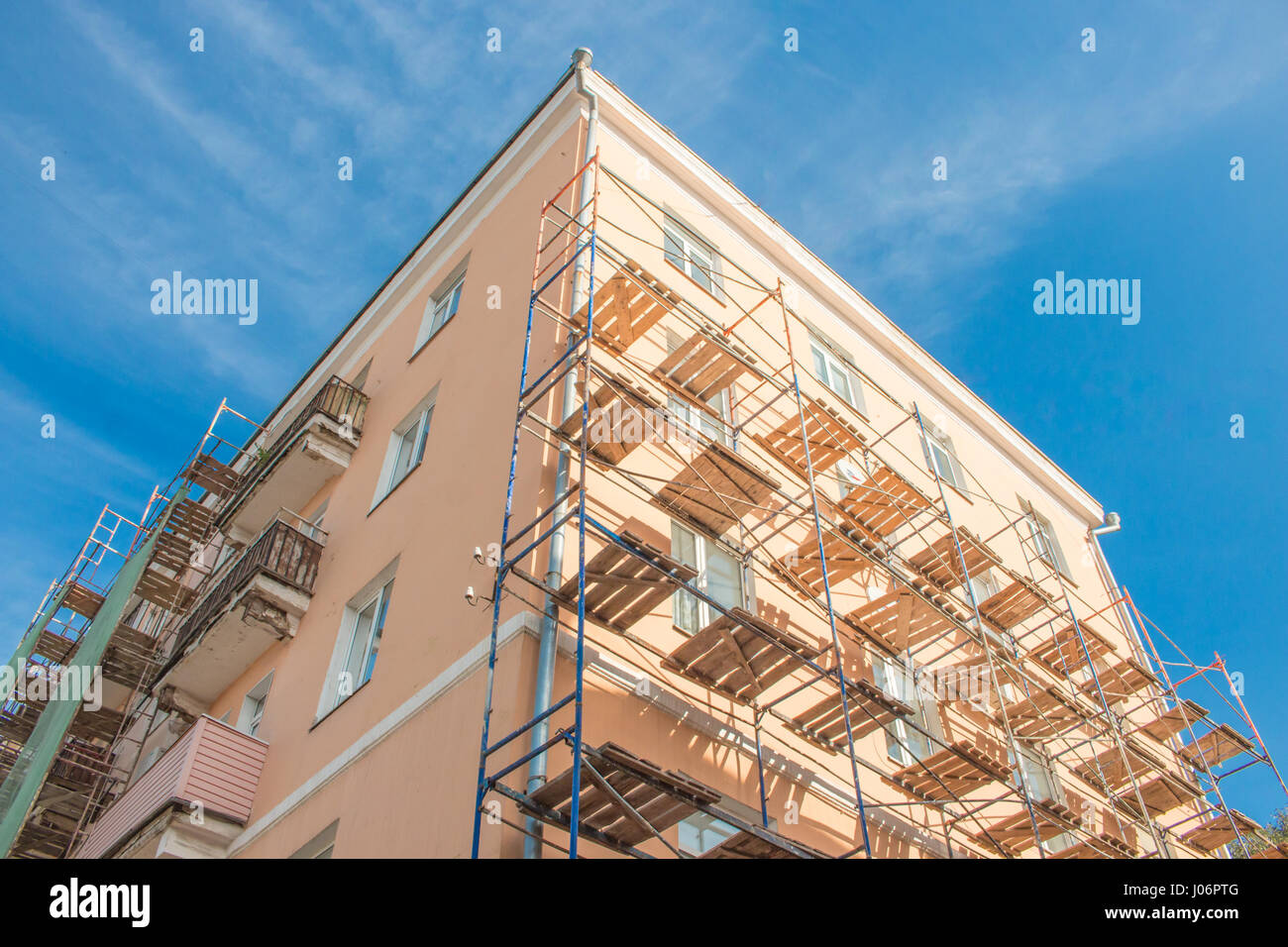 Scaffolding near the building bright sunny day blue sky Stock Photo - Alamy