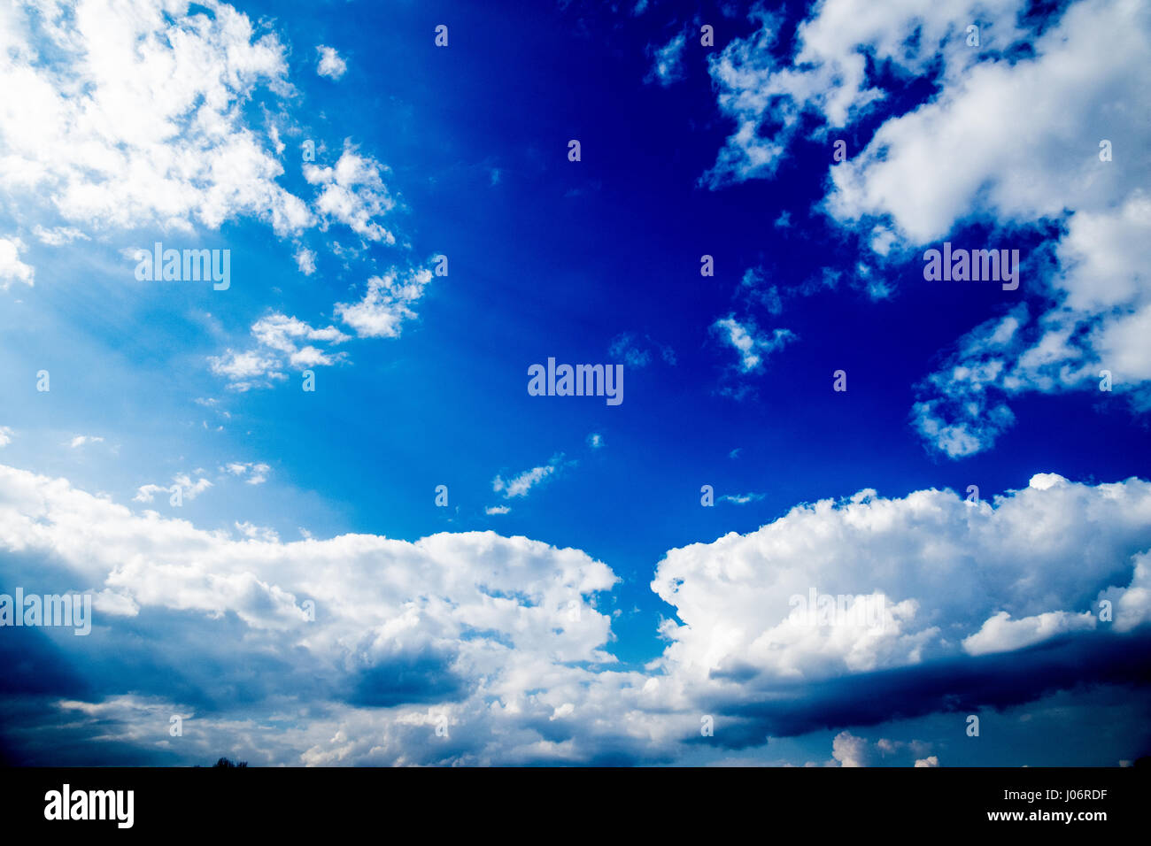 beautiful blue sky with clouds and sun rays Stock Photo - Alamy