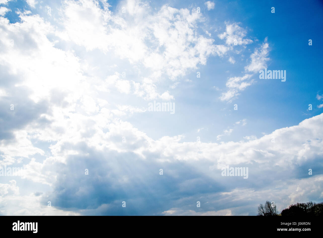beautiful blue sky with clouds and sun rays Stock Photo - Alamy