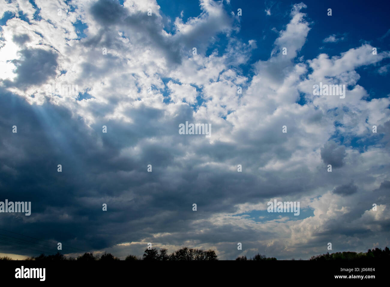 beautiful blue sky with clouds and sun rays Stock Photo - Alamy