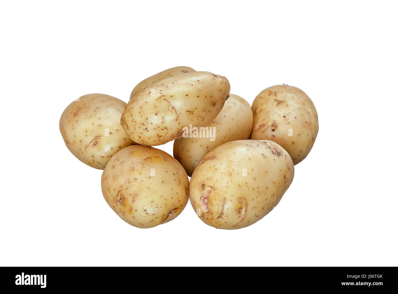 new potatoes ripe round group lying on a white background isolate Stock ...