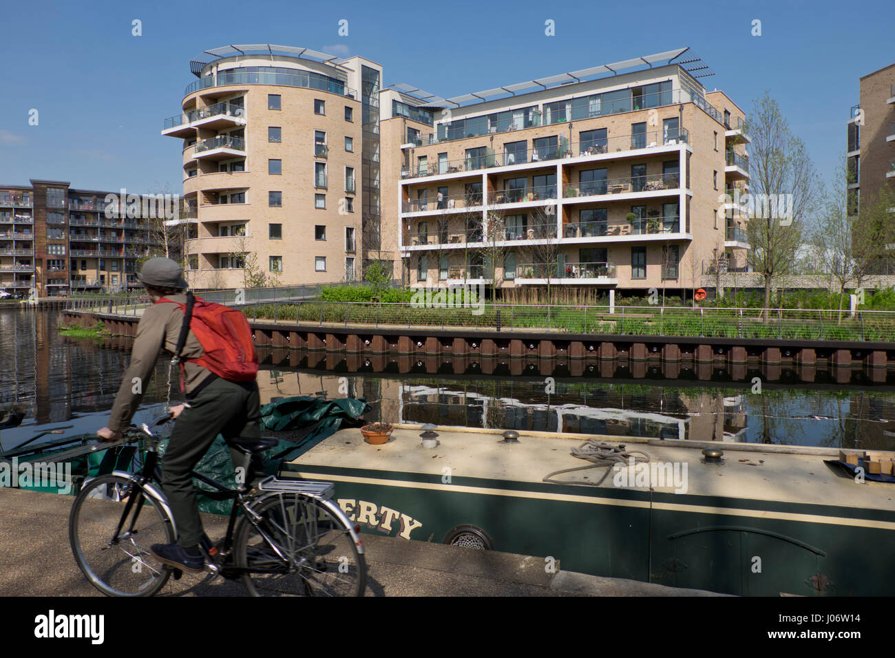 New luxury housing buildings by Lea River canal, with boats in ...