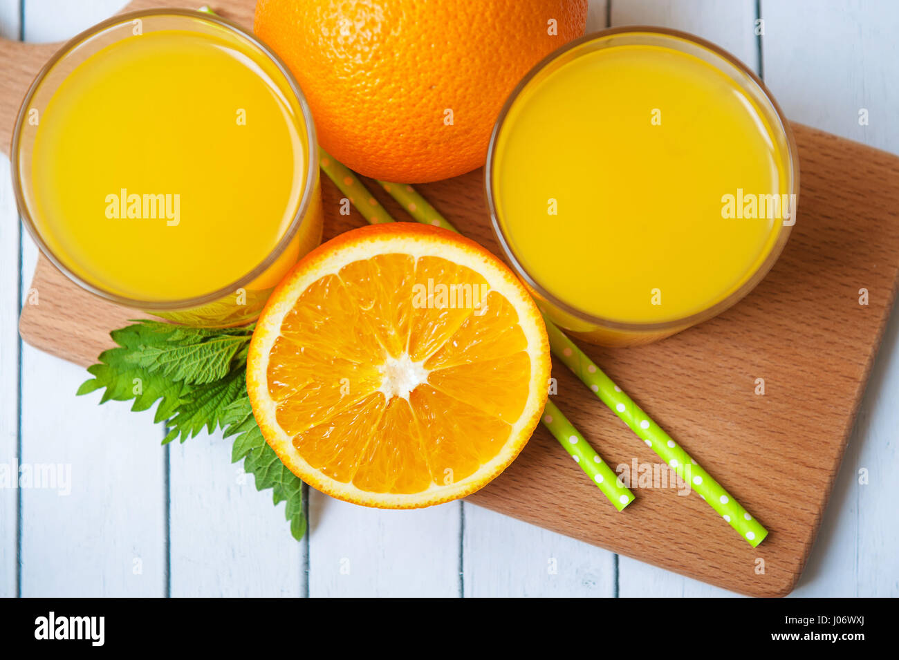 Glass of orange juice from above on wood table Stock Photo - Alamy
