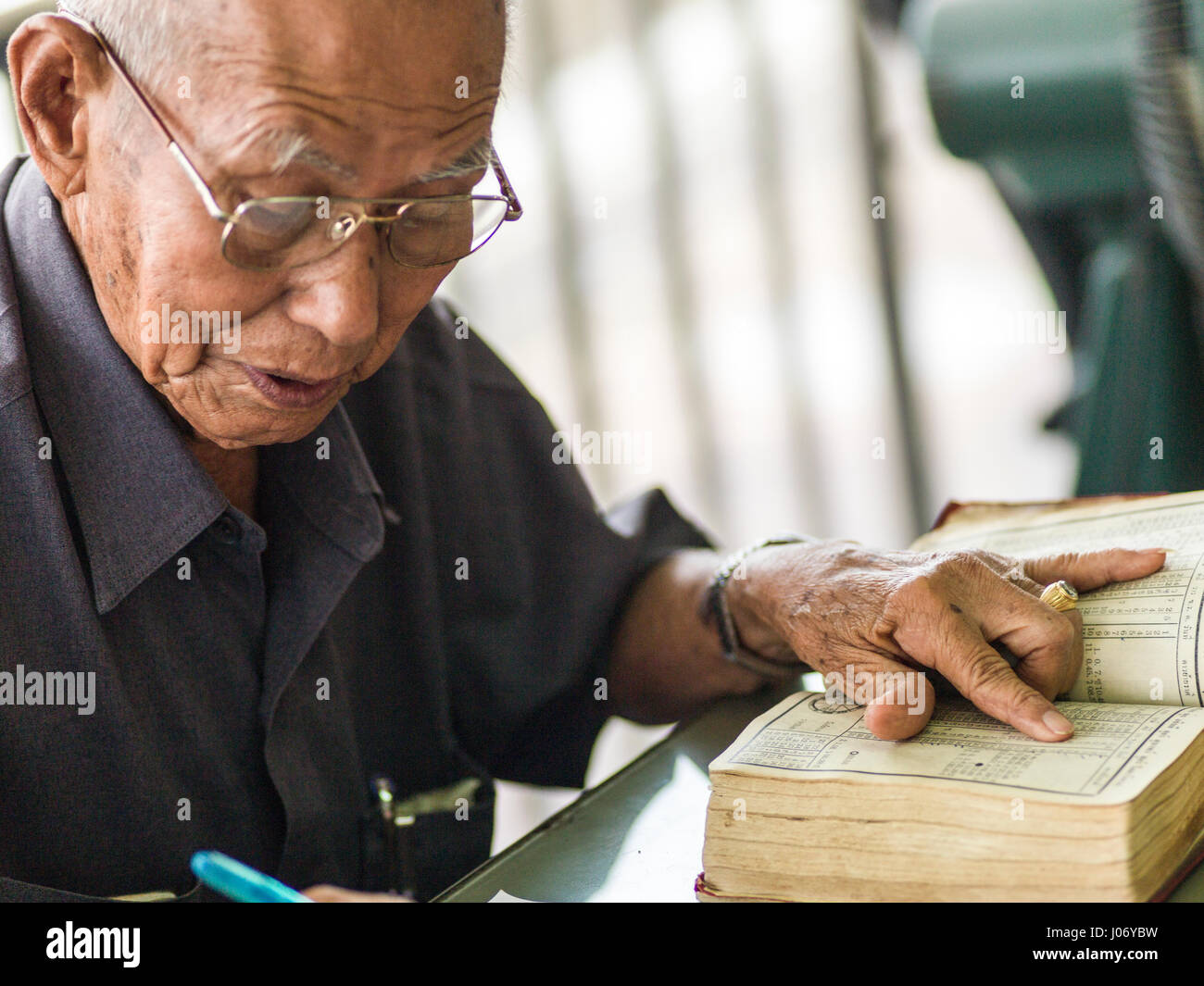 Man writing in book hi-res stock photography and images - Alamy
