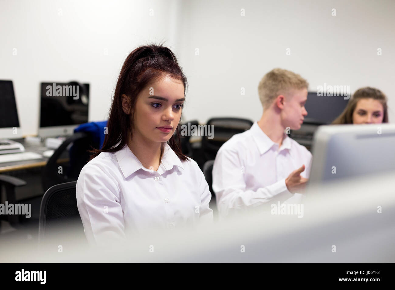 Teenage students using computers at school Stock Photo - Alamy