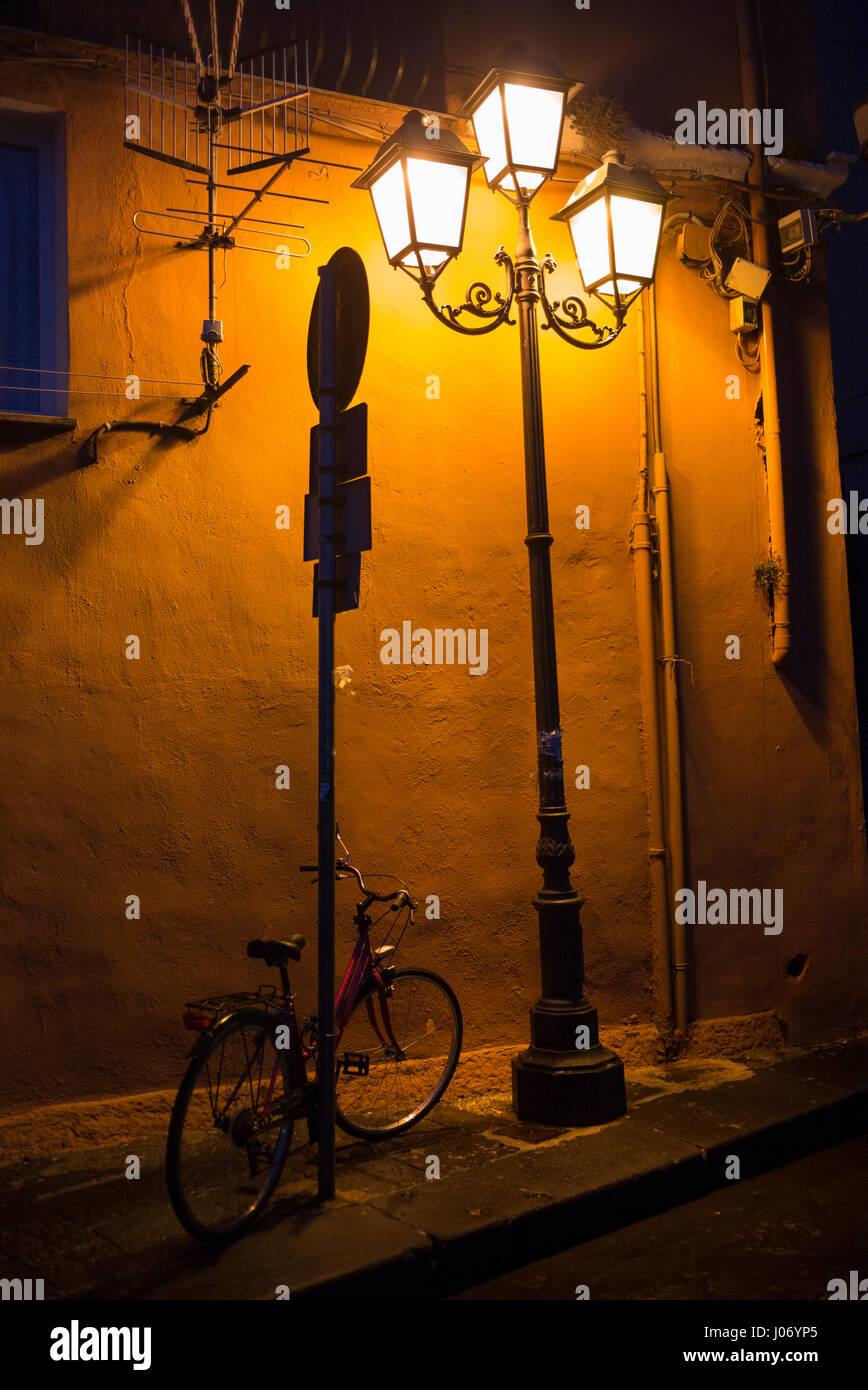 Illuminated lamps on street at night, Campania, Italy Stock Photo - Alamy