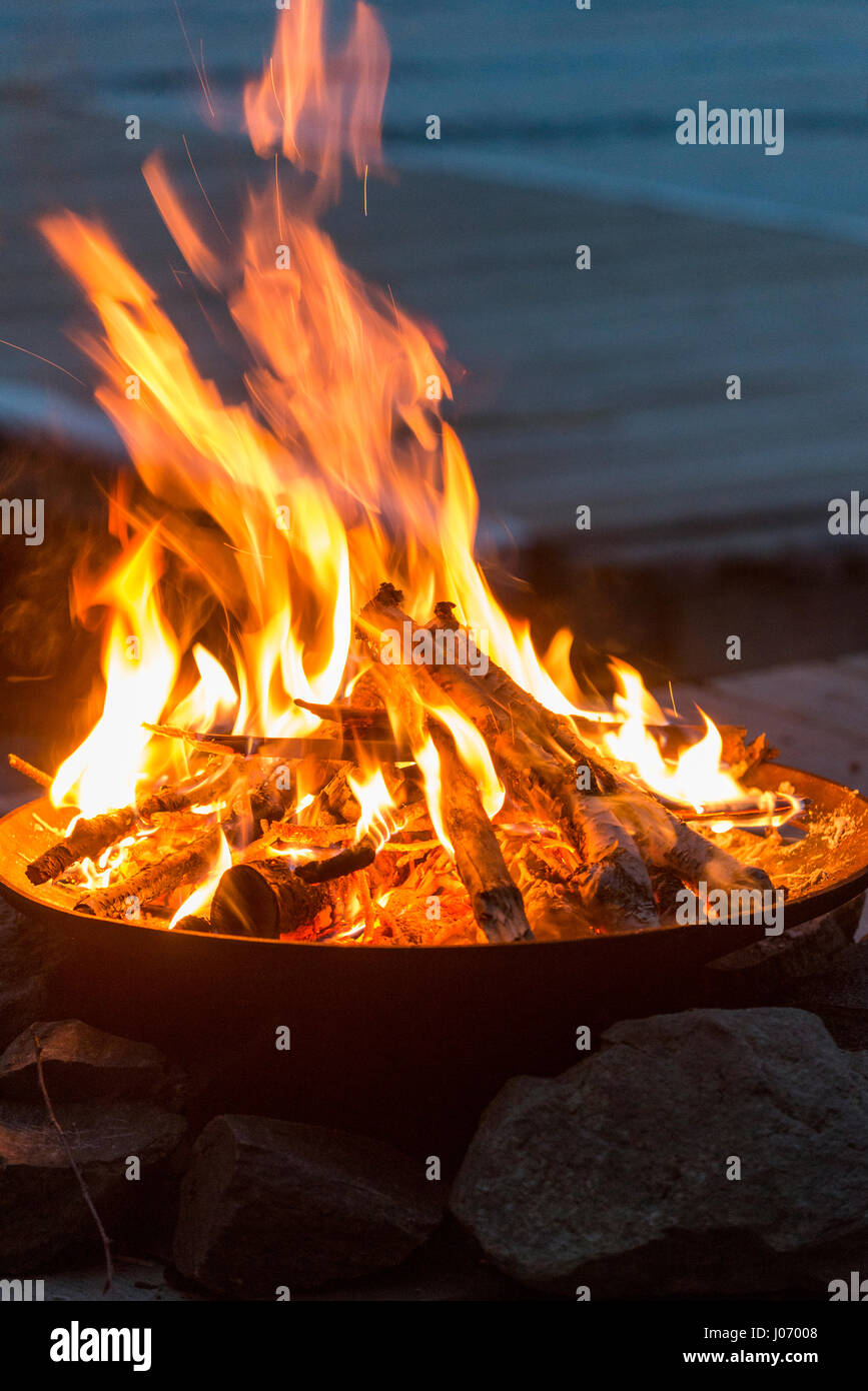 Campfire on dock, Lake of The Woods, Ontario, Canada Stock Photo - Alamy