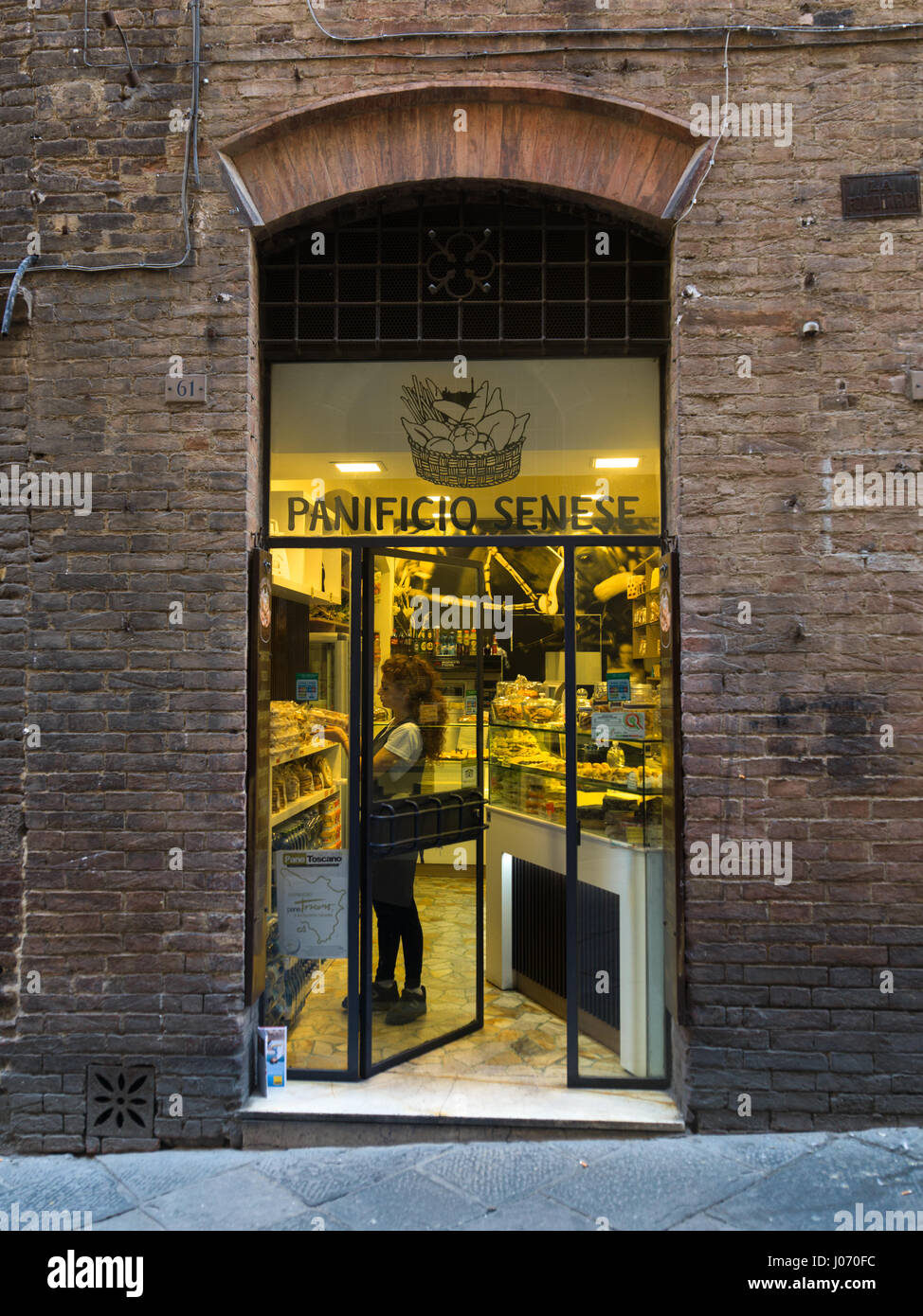 Woman shopping in a store, Siena, Tuscany, Italy Stock Photo - Alamy