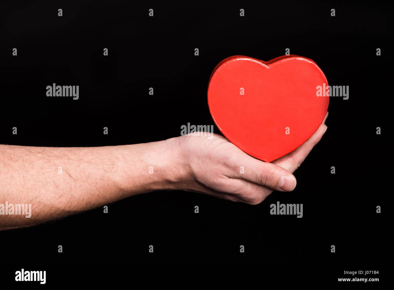 Hand holding heart hi-res stock photography and images - Alamy