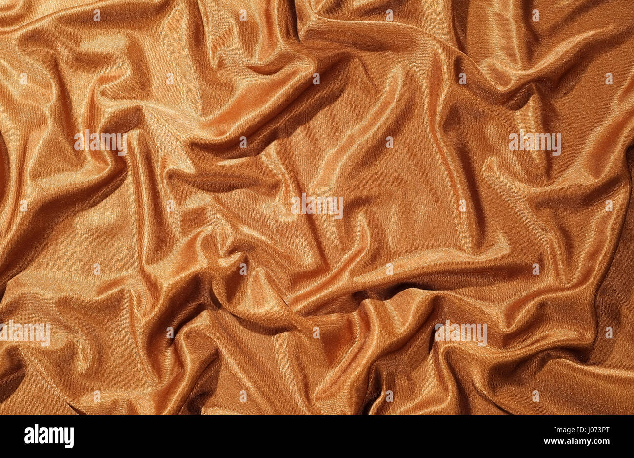 Cloth background in golden color Stock Photo - Alamy
