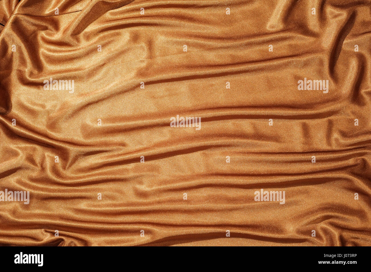 Cloth background in golden color Stock Photo - Alamy