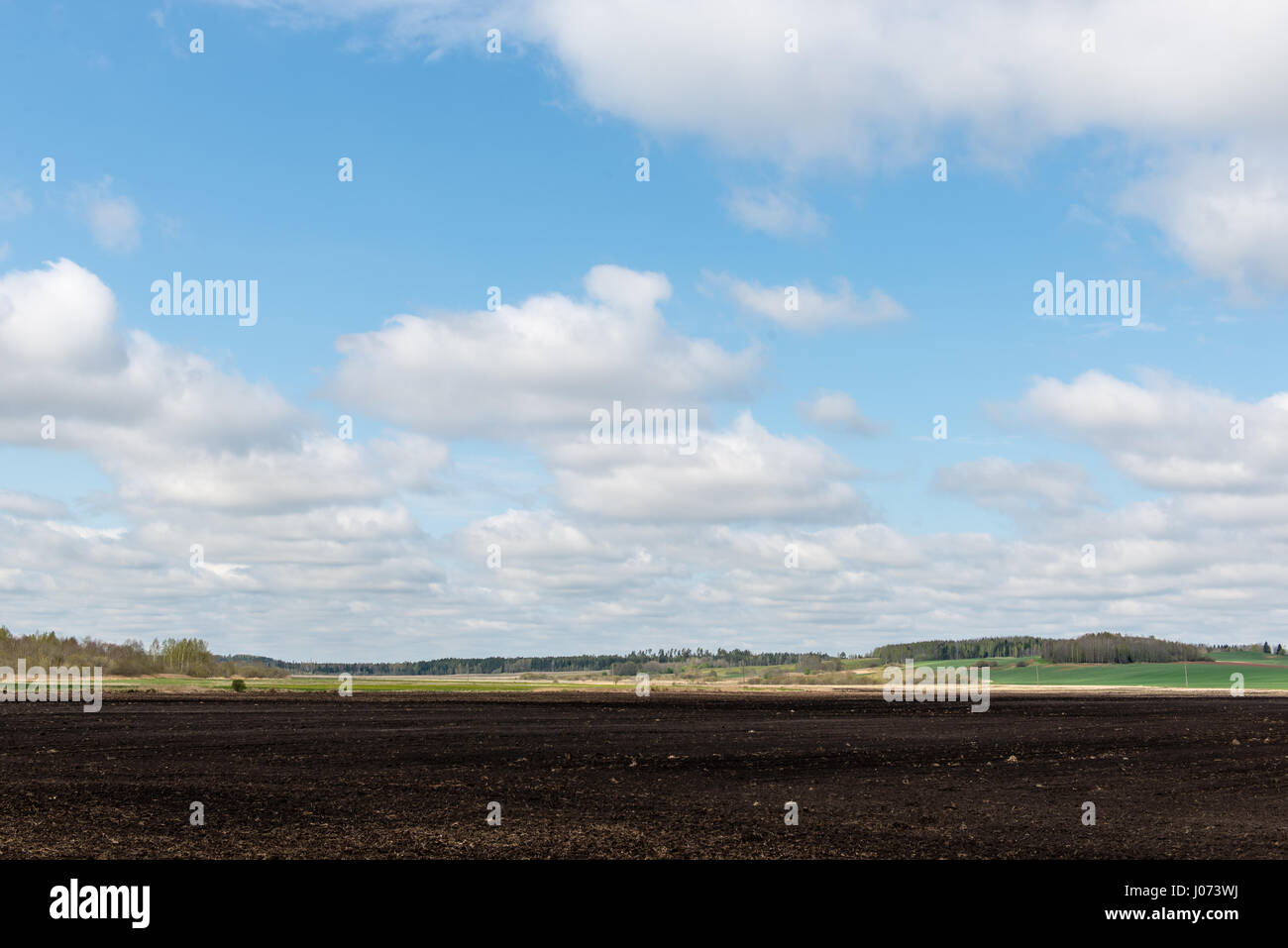 countryside fields in early spring with clouds and farmland Stock Photo ...