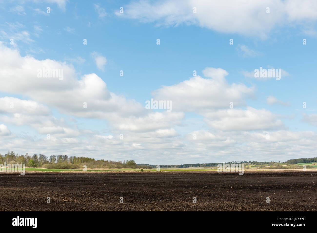 countryside fields in early spring with clouds and farmland Stock Photo ...
