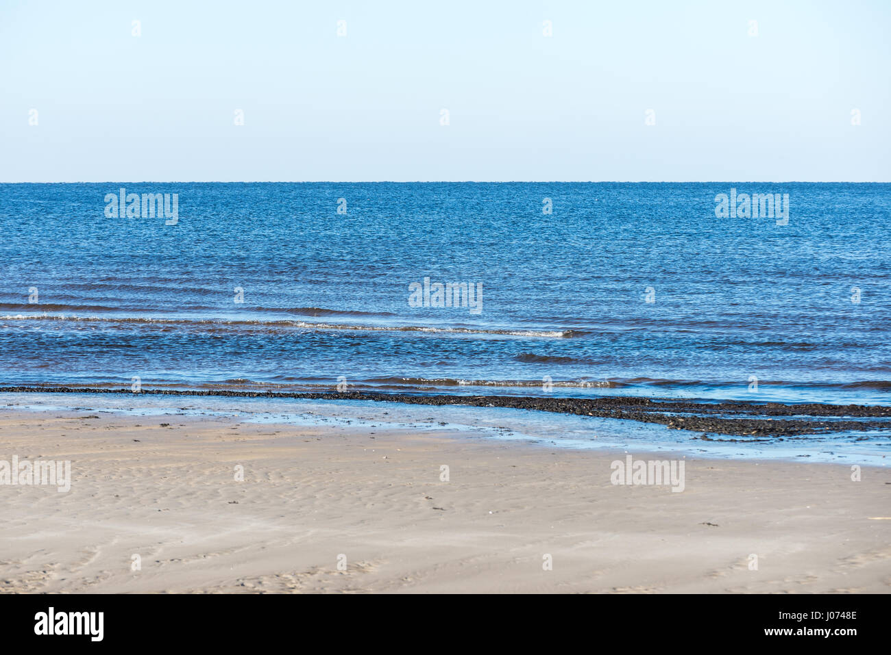 icy sea beach with first ice pieces in baltic sea. latvia Stock Photo ...