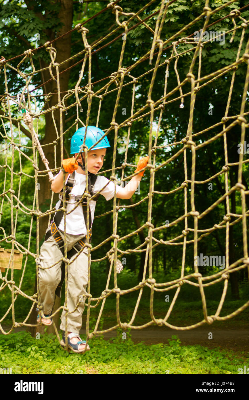Five year boy on rope-way in forest Stock Photo - Alamy
