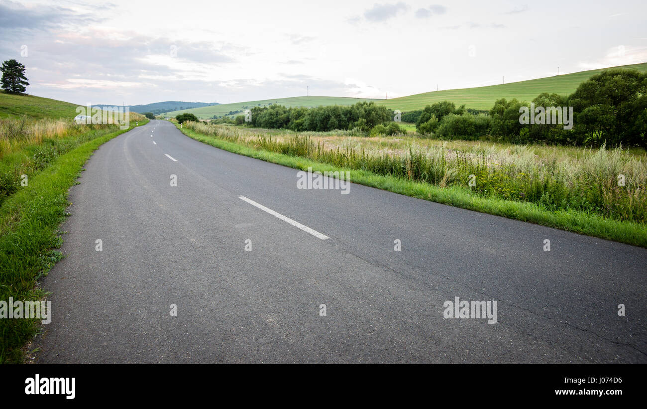 mountain country road in summer at countryside with trees around Stock ...
