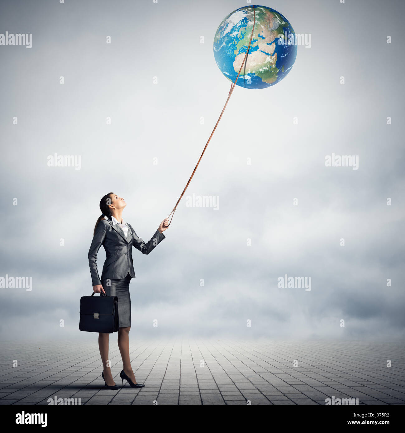 Woman catch Earth planet Stock Photo - Alamy