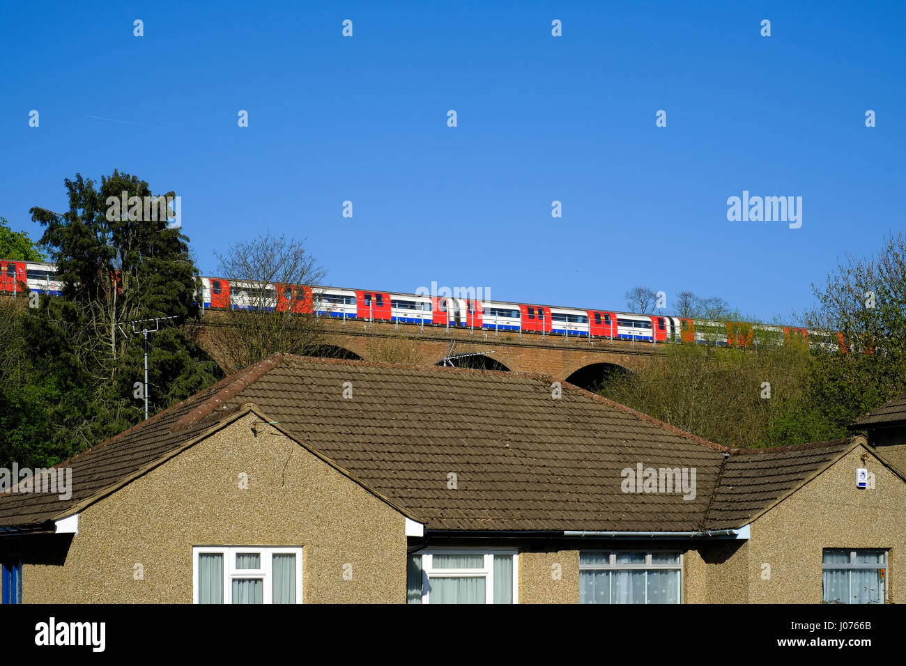 London underground train over bridge Stock Photo - Alamy