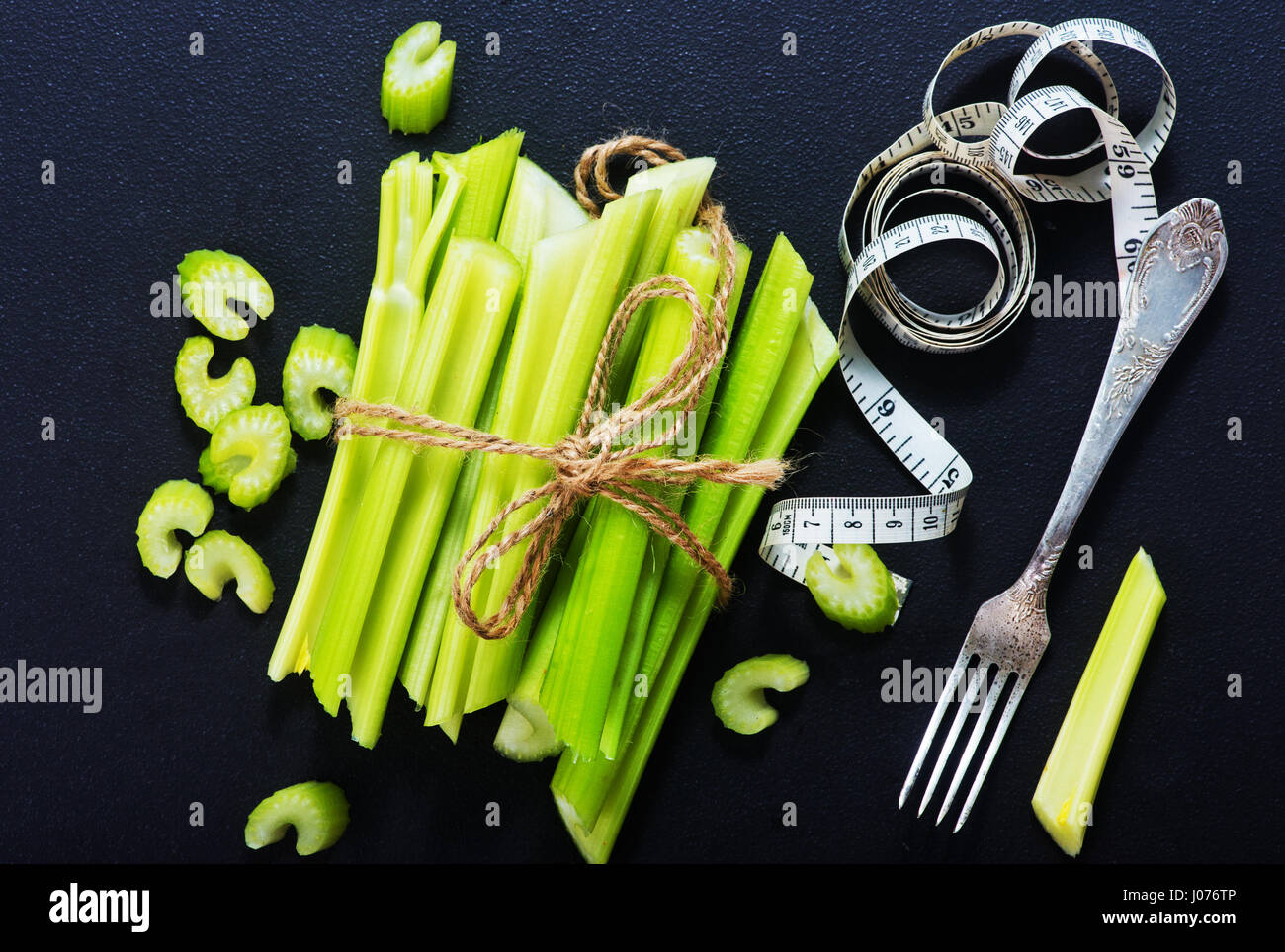 raw celery on black table, fresh celery Stock Photo - Alamy