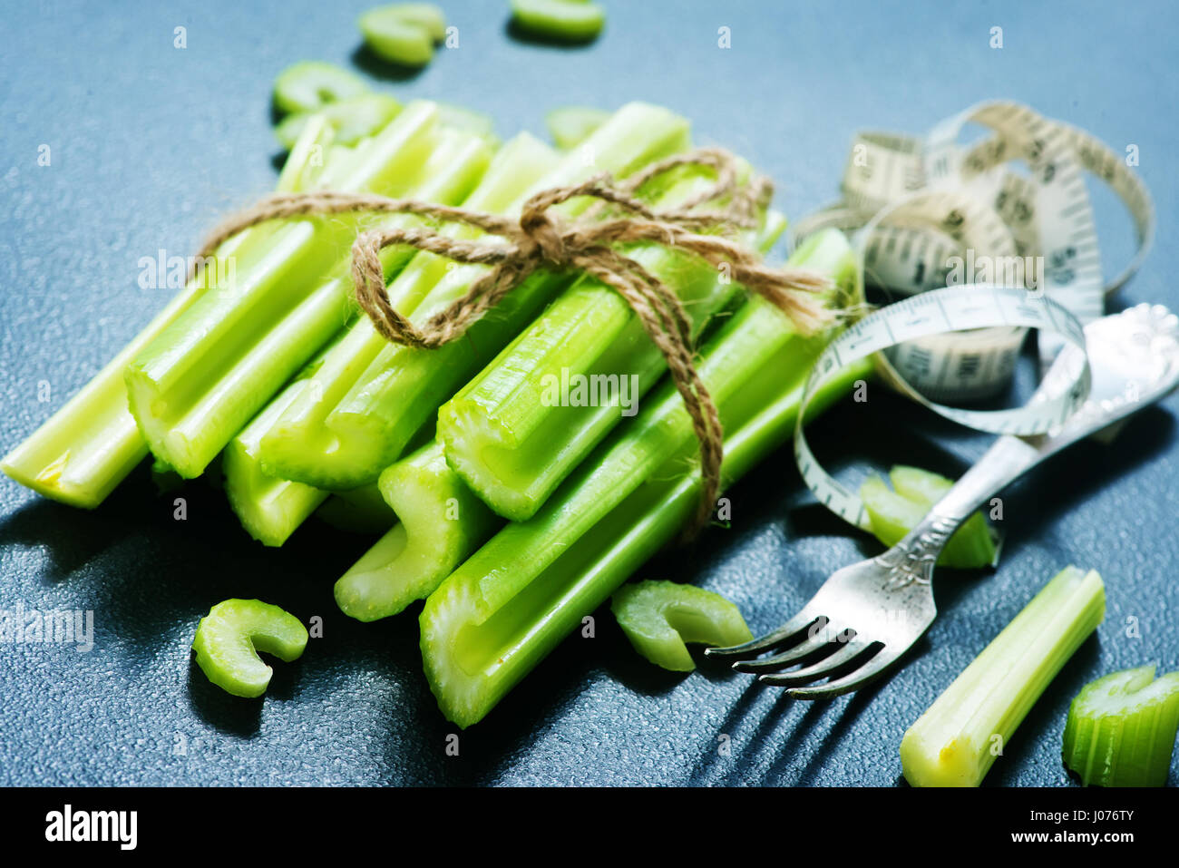 raw celery on black table, fresh celery Stock Photo - Alamy