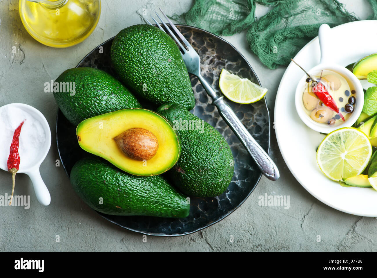 fresh avocado, lime and spice on a table Stock Photo - Alamy