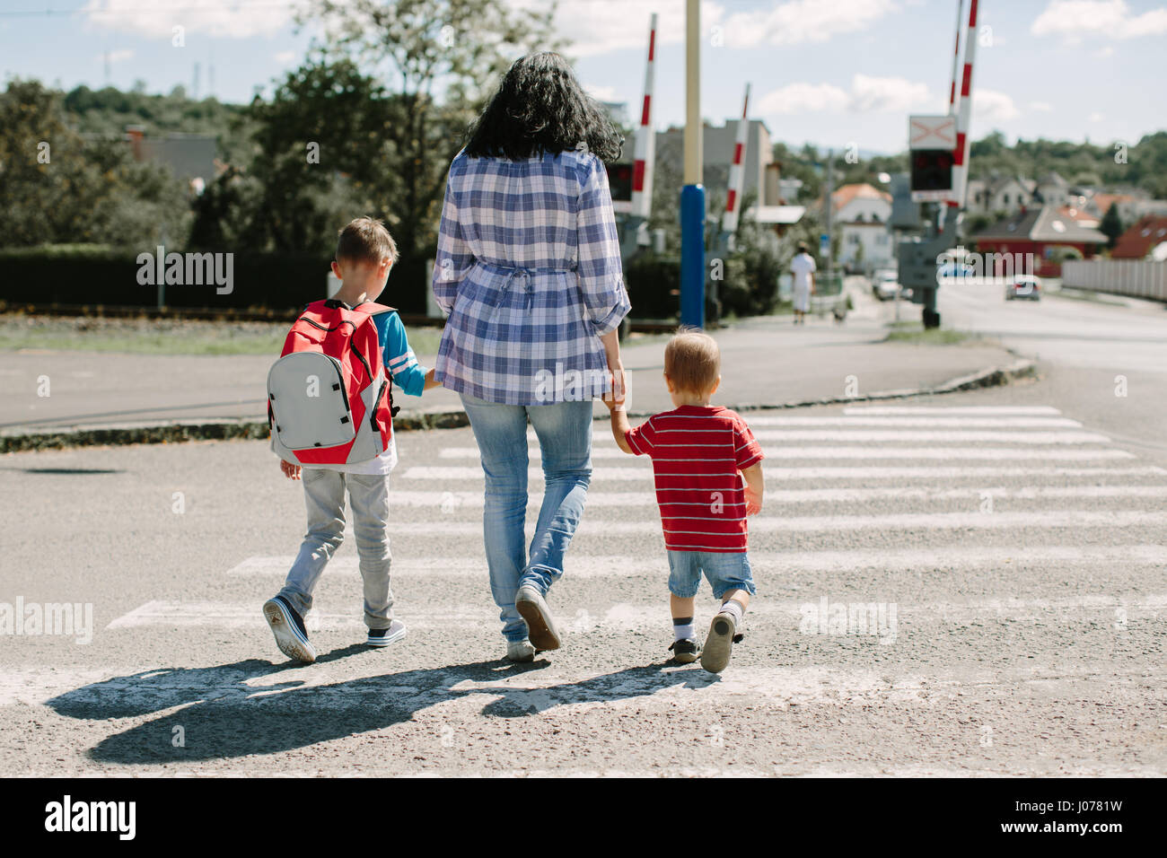 Mother Holding Children Crossing Road High Resolution Stock Photography ...