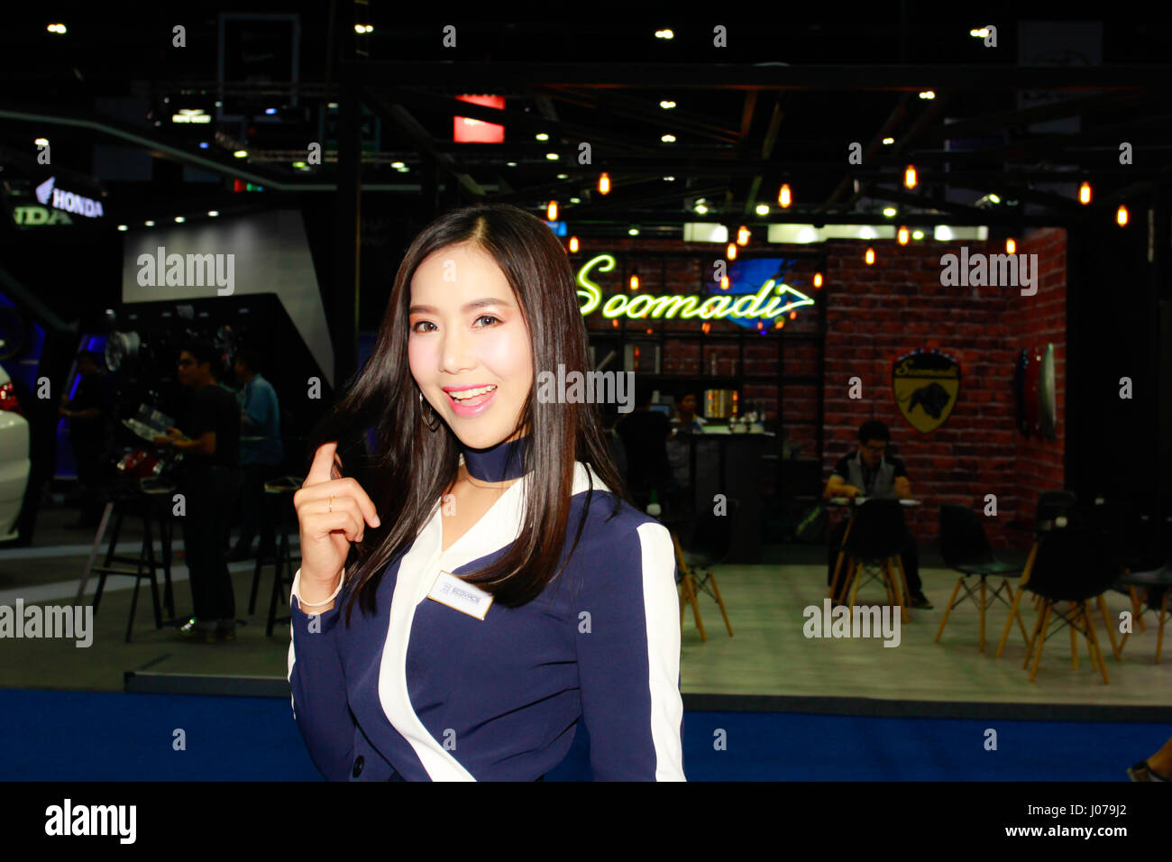 BANGKOK, THAILAND - APRIL 09, 2017: Unidentified female presenter pose ...