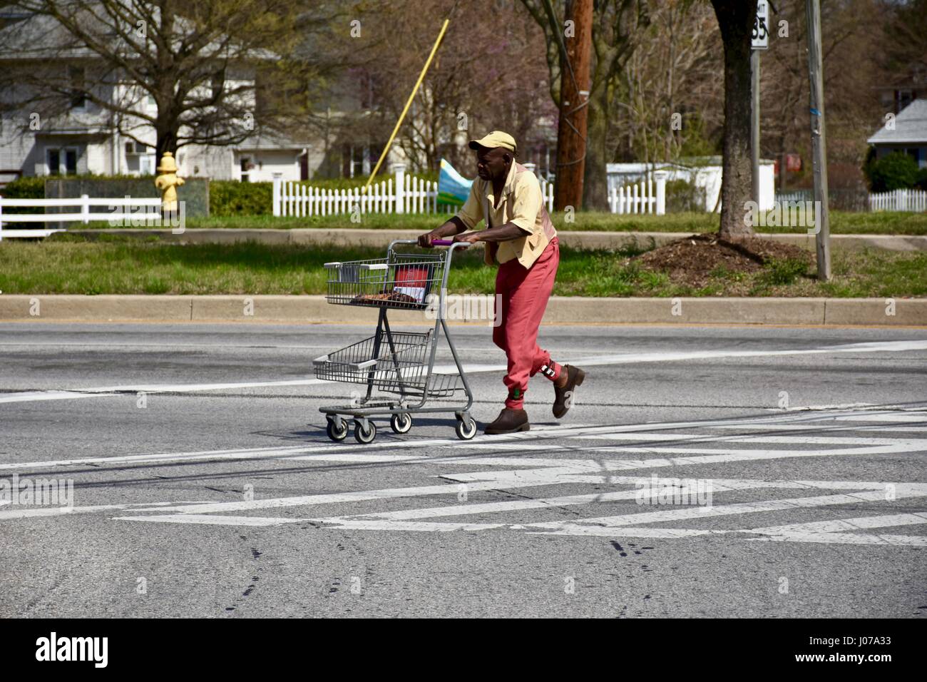 Homeless man pushing shopping cart hi-res stock photography and images ...