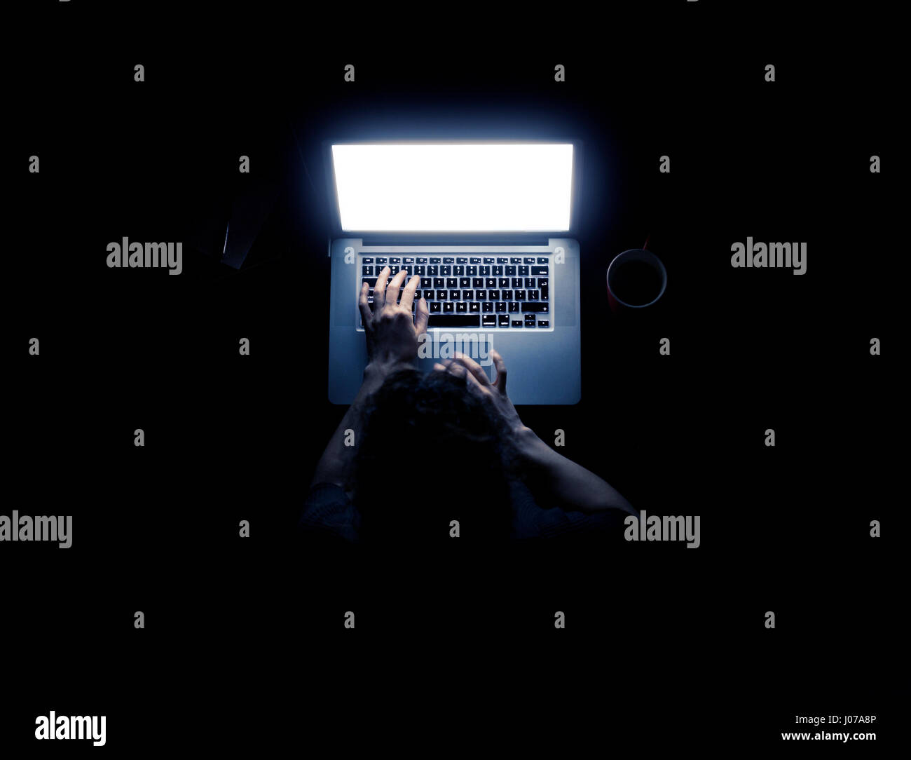 Woman lit by laptop screen hi-res stock photography and images - Alamy