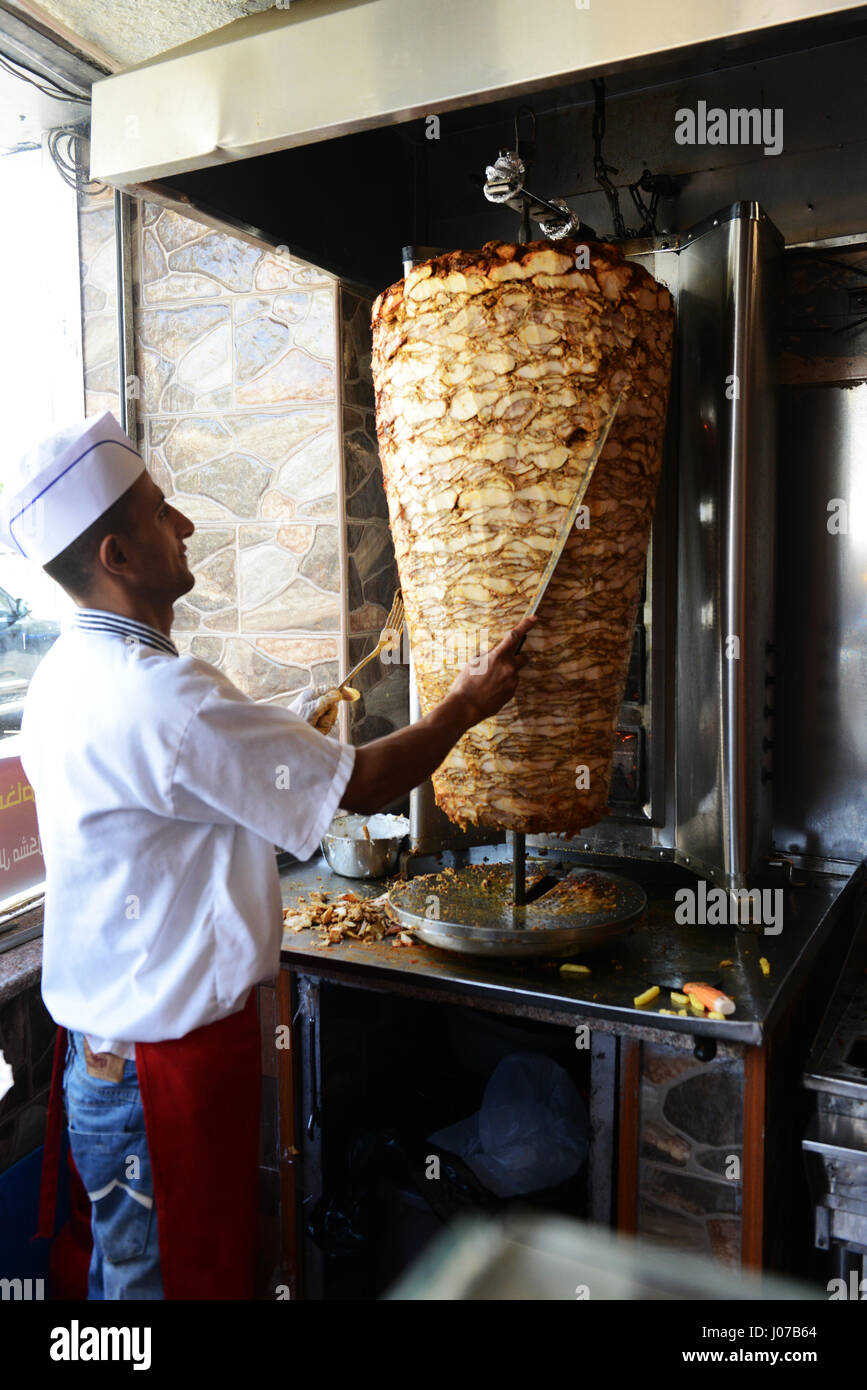 Cutting Shawarma in a popular restaurant in Aqaba, Jordan Stock Photo ...