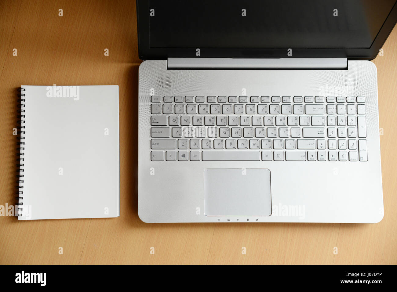 notebook and computer laptop on wood background Stock Photo - Alamy