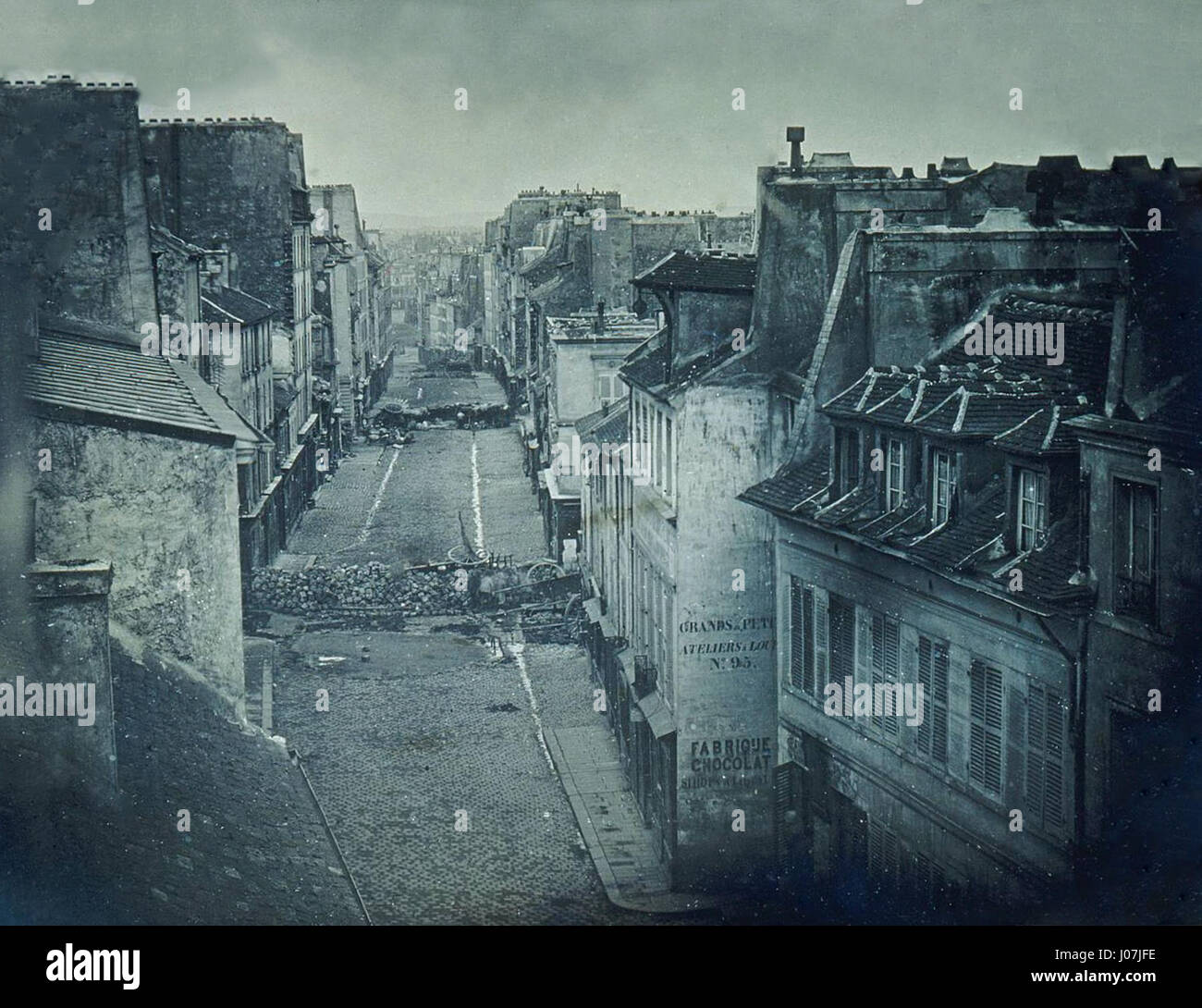 This historical image depicts the barricades on Rue Saint-Maur during ...