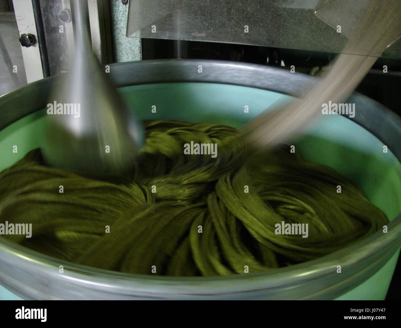 This image depicts linen thread produced after the combing process. The ...