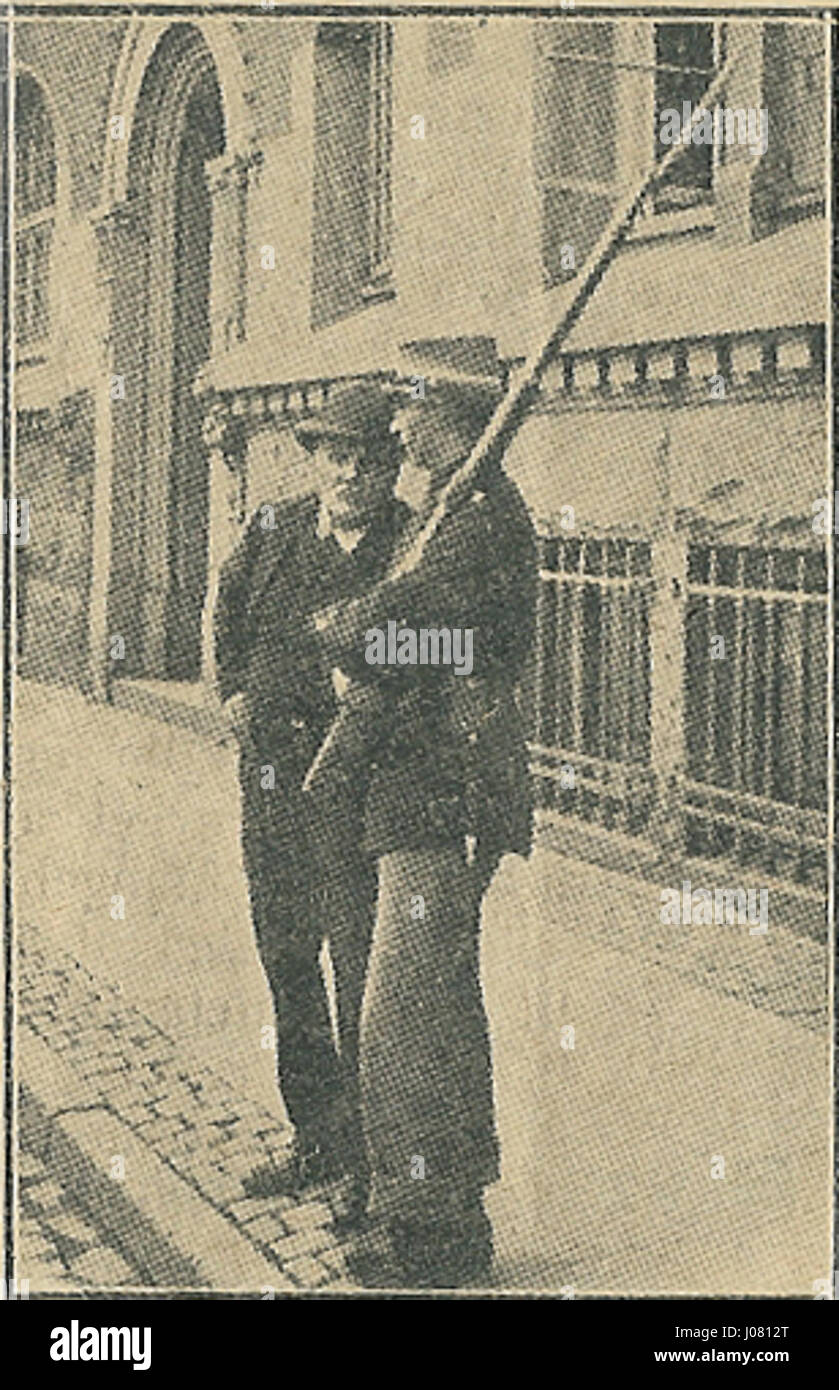 This photograph, taken in 1914, depicts a soldier standing by a ...