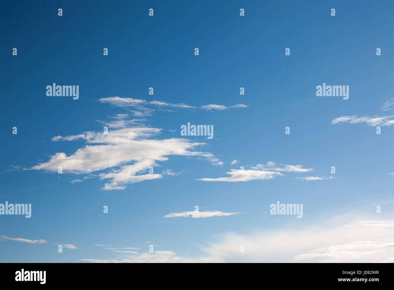 Bright clear sky with white clouds. Summer sunny day Stock Photo - Alamy
