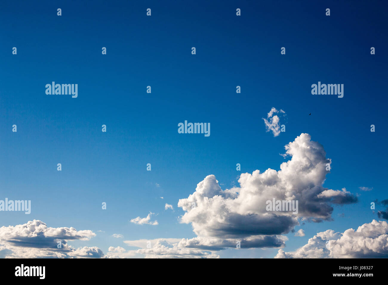 Bright clear sky with white clouds. Summer sunny day Stock Photo - Alamy