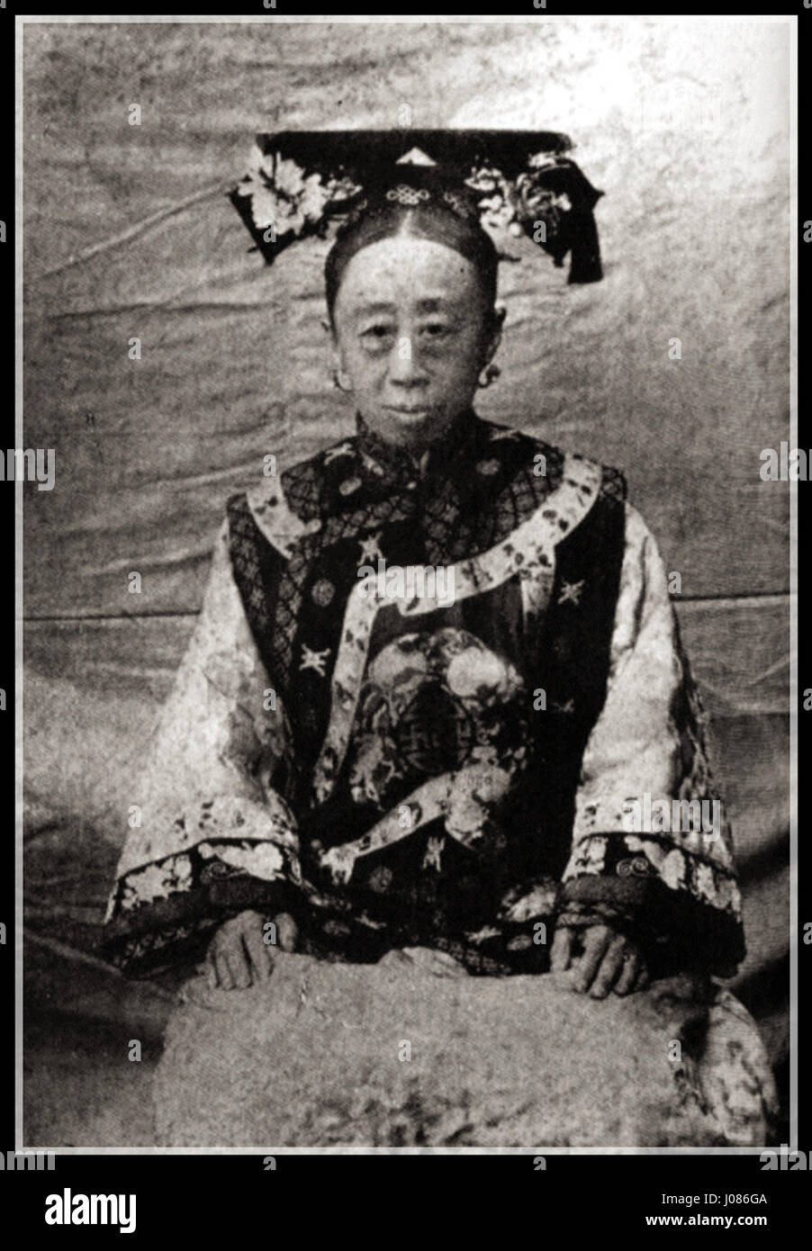 This artwork features a traditional Asian design, focusing on intricate ...