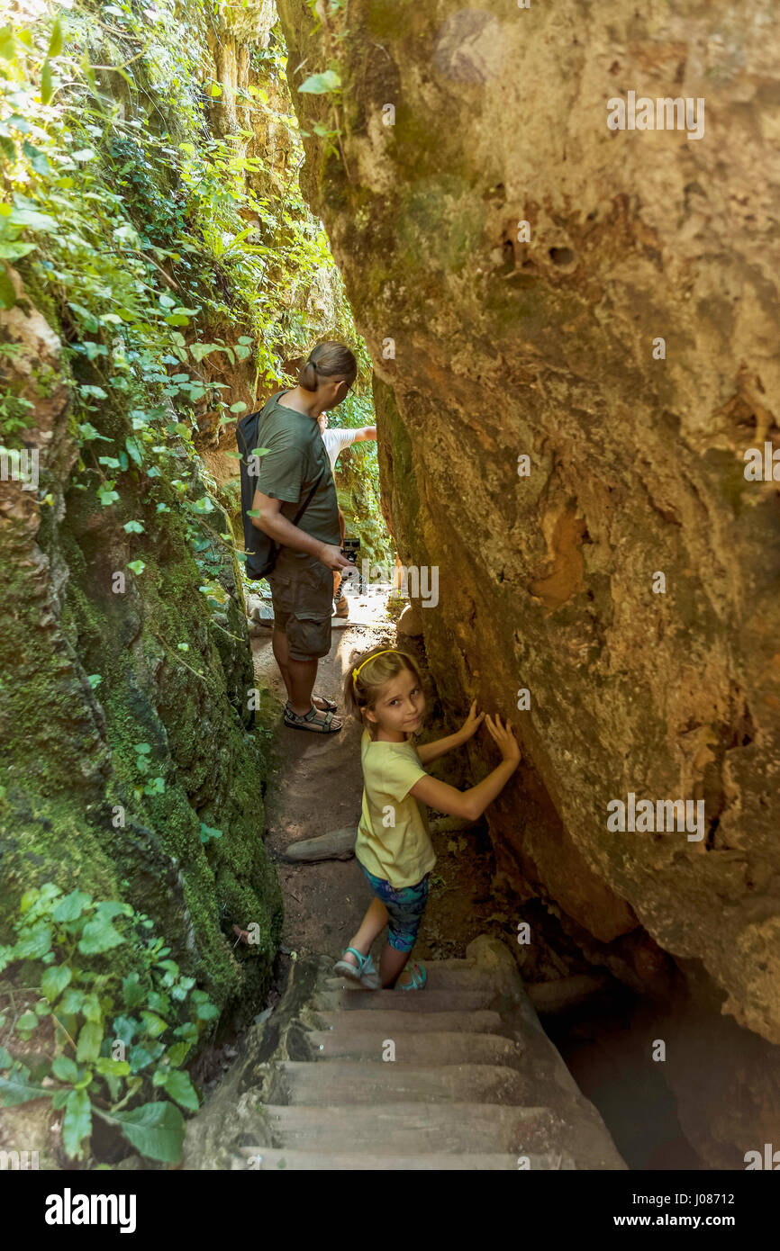 Tourists visiting caves on Korana river in Rastoke village near Slunj ...