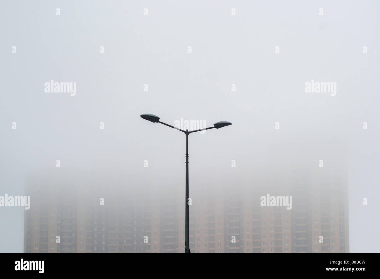 lantern in the mist on the building of homes Stock Photo - Alamy