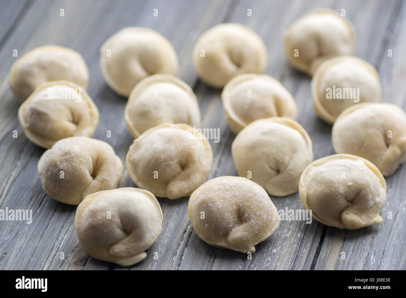 cooking dumplings molding with his hands on wooden background Stock ...