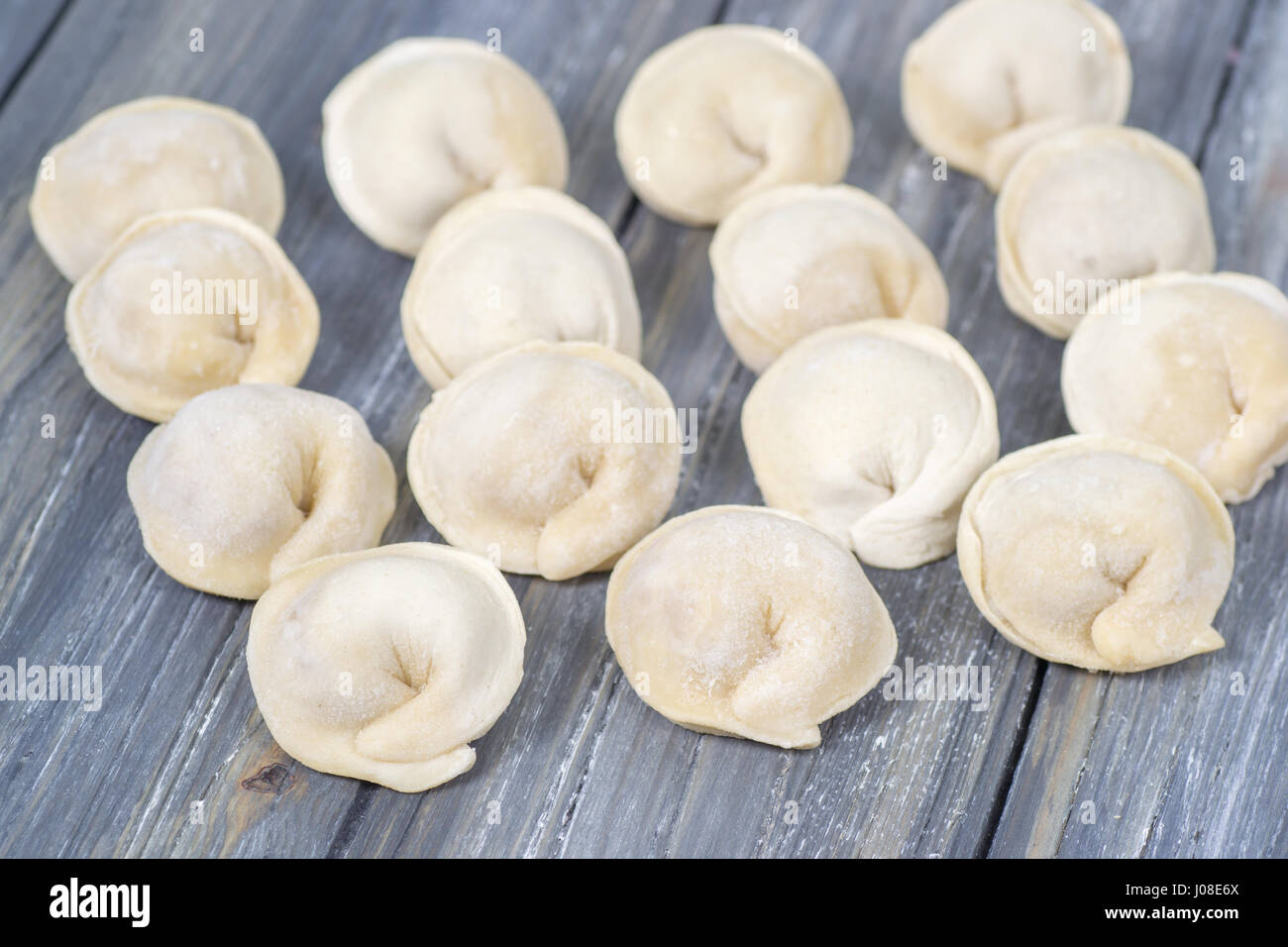 cooking dumplings molding with his hands on wooden background Stock ...