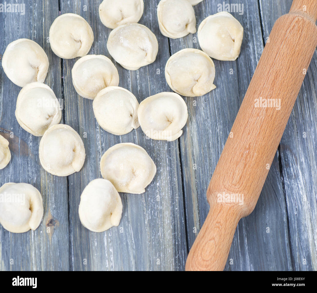 cooking dumplings molding with his hands on wooden background Stock ...