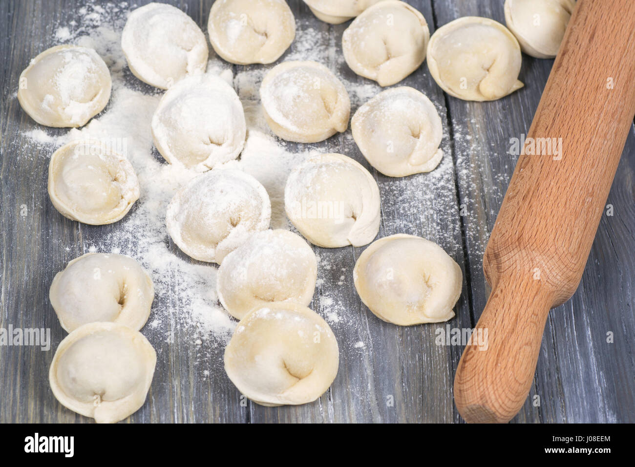 cooking dumplings molding with his hands on wooden background Stock ...