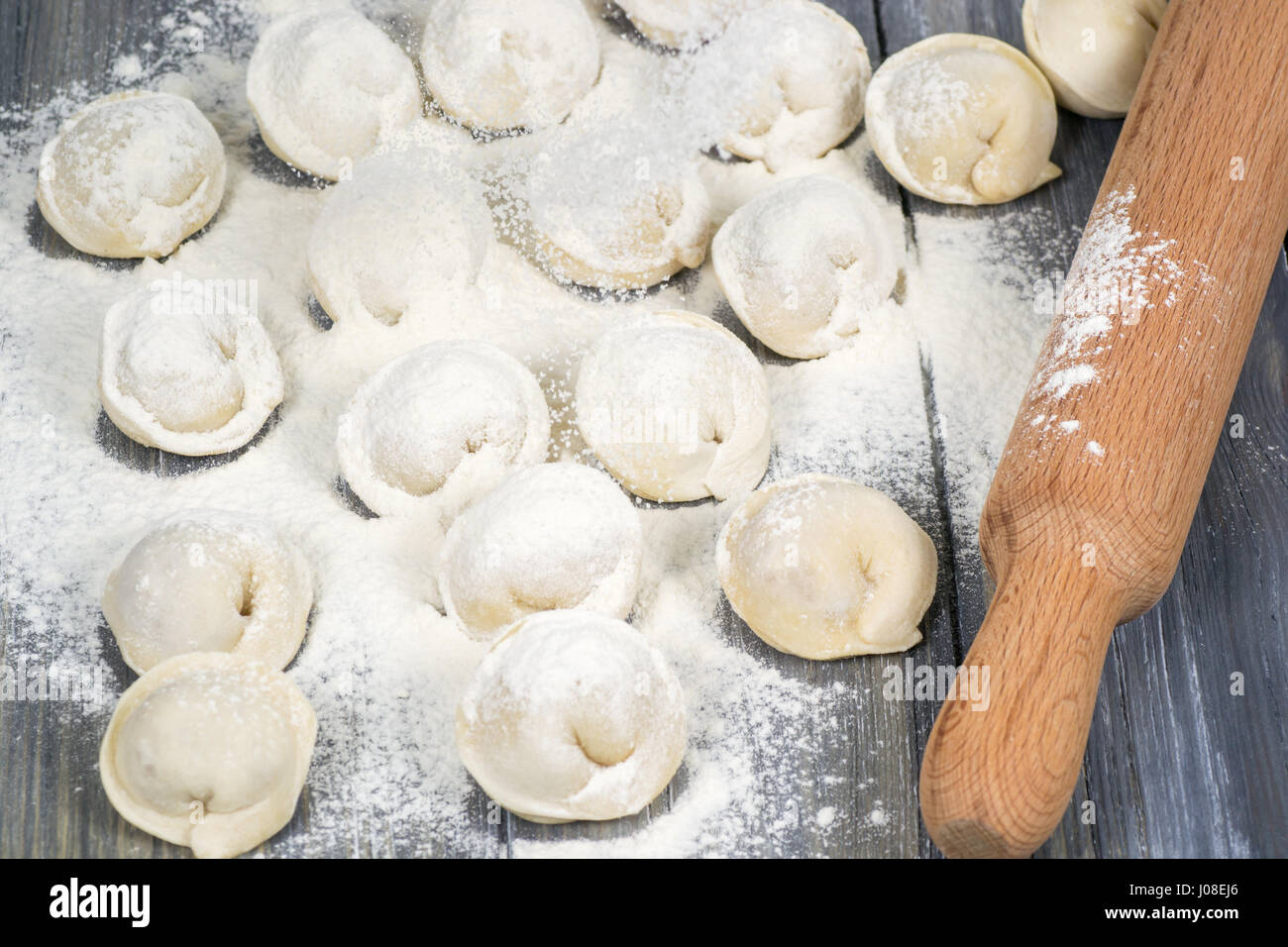 cooking dumplings molding with his hands on wooden background Stock ...