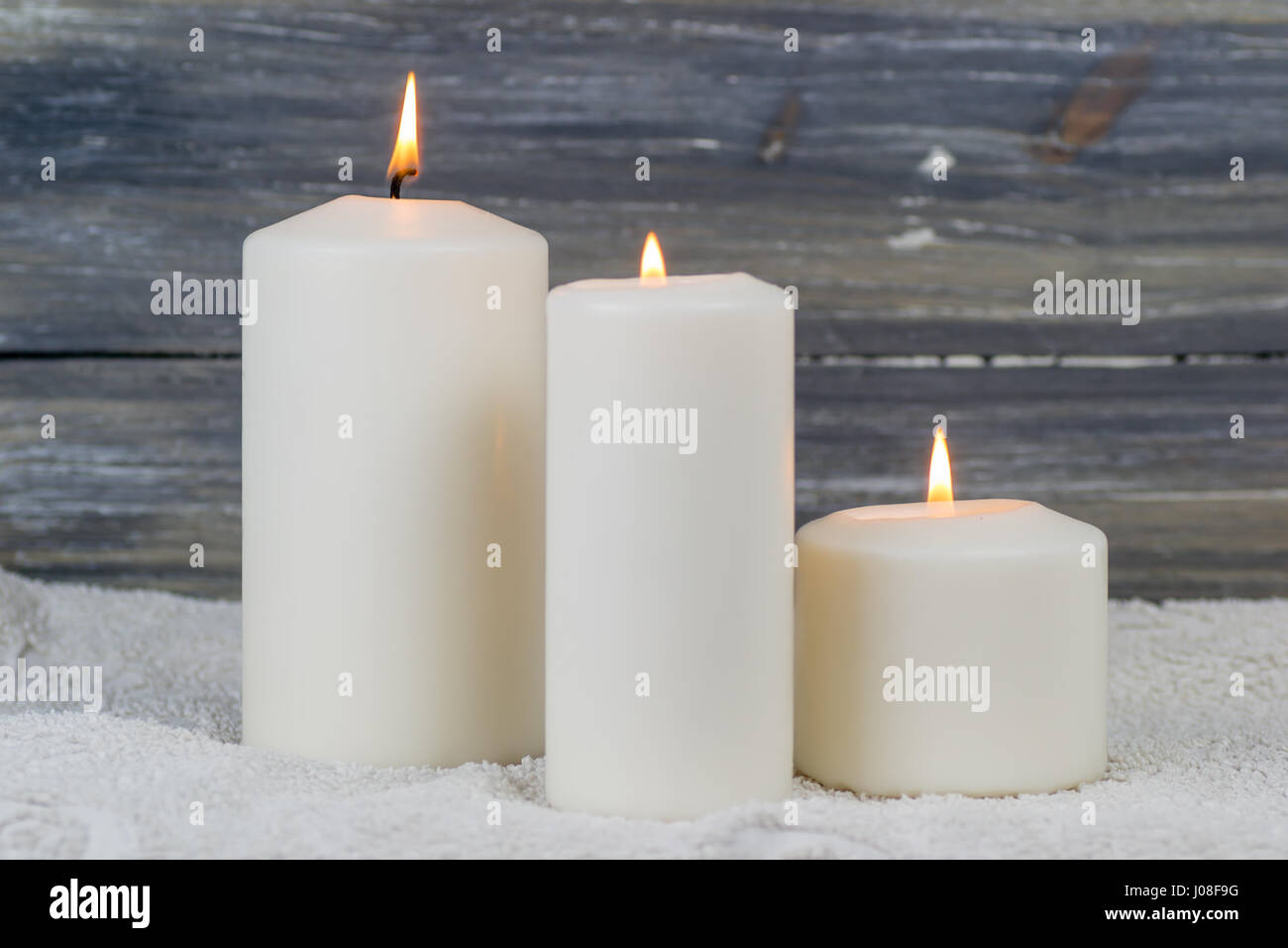 a candle is lit in the darkness and gives spiritual warmth Stock Photo ...