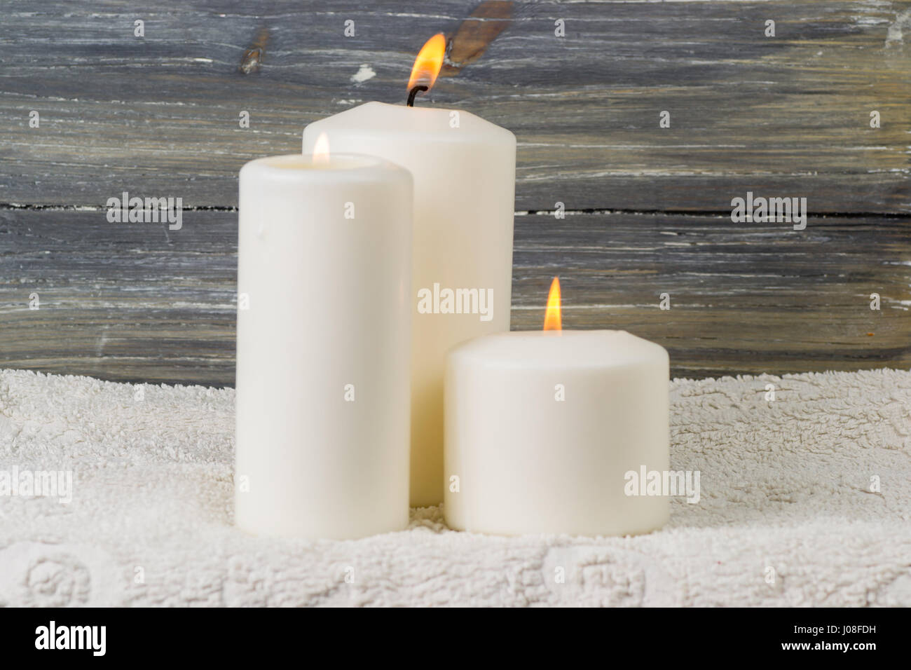 a candle is lit in the darkness and gives spiritual warmth Stock Photo ...