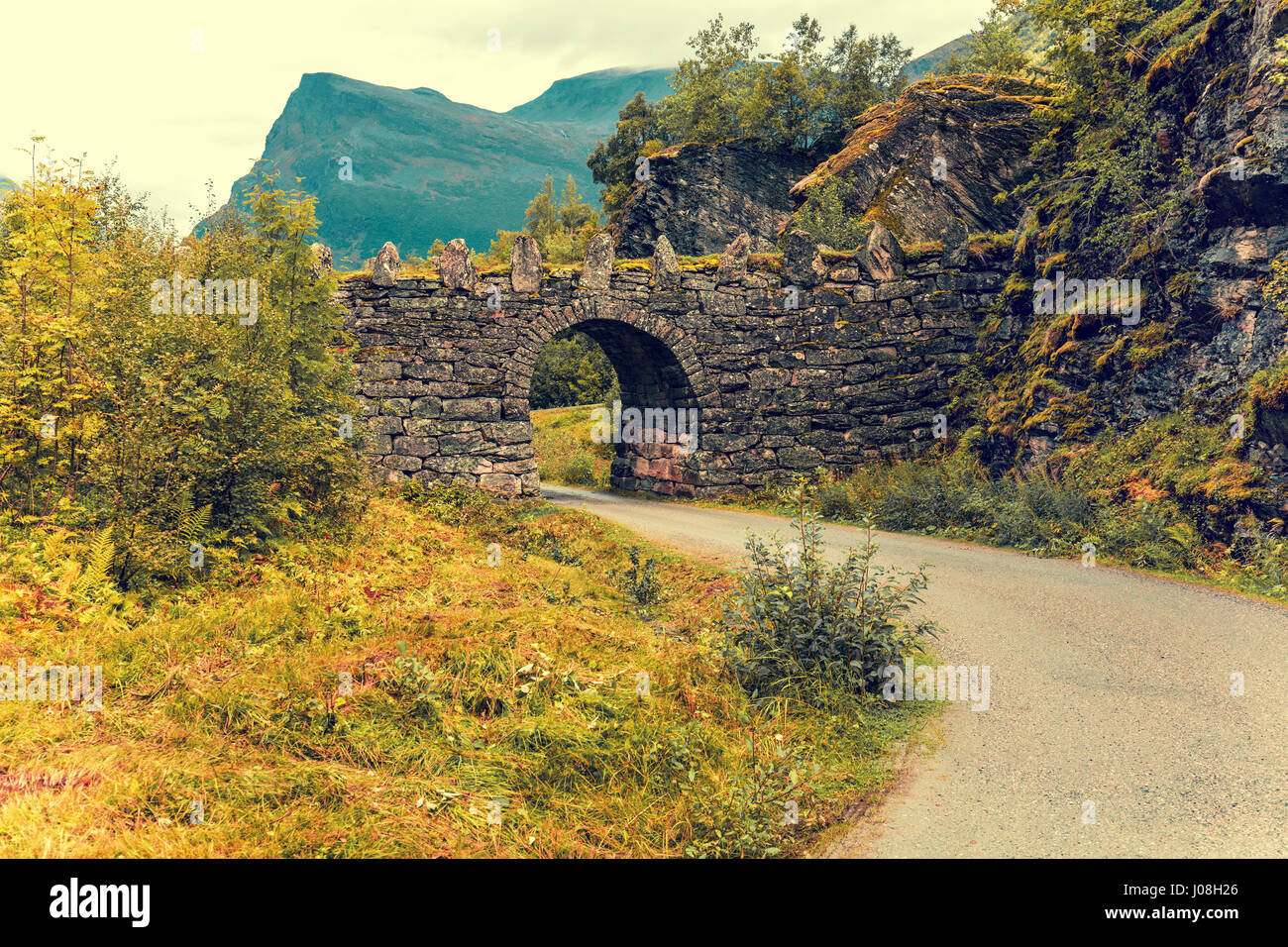 Stone arch over the road. Beautiful nature Stock Photo - Alamy