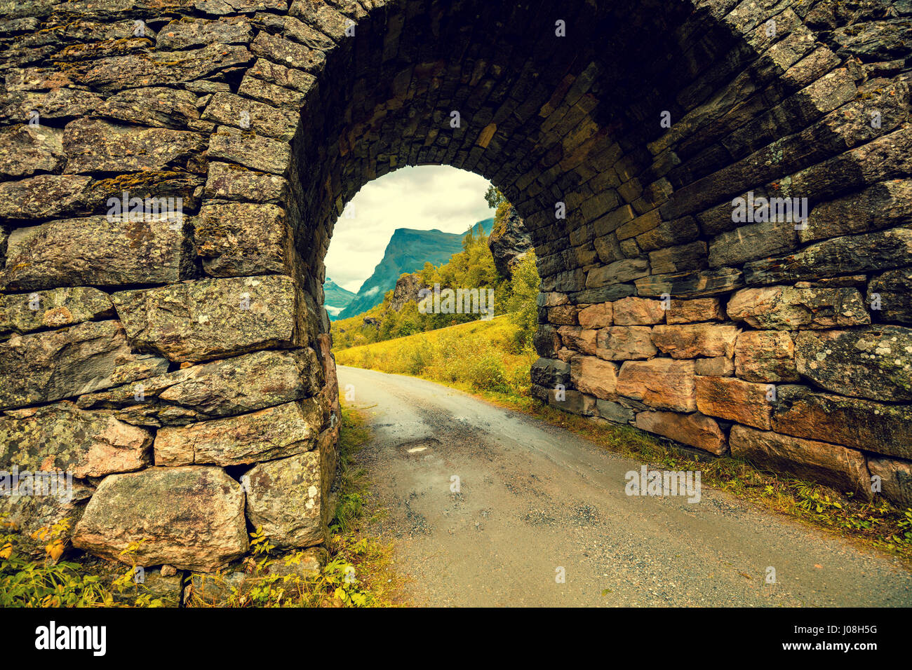 Stone arch over the road. Beautiful nature Stock Photo - Alamy