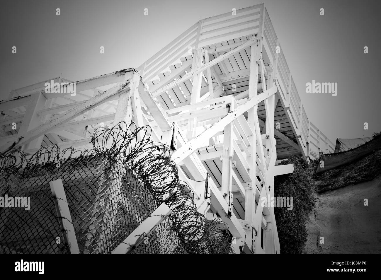 Wooden stairs on cliff leading to beach Stock Photo - Alamy