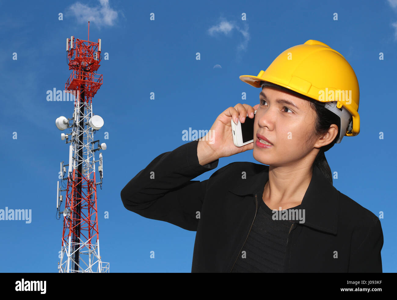 Business woman call smartphone and Telephone tower on blue sky ...